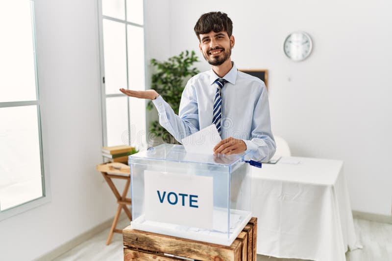 Hispanic Man with Beard Voting Putting Envelop in Ballot Box Smiling ...