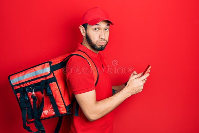 Hispanic Man With Beard Wearing Delivery Package Backpack Using