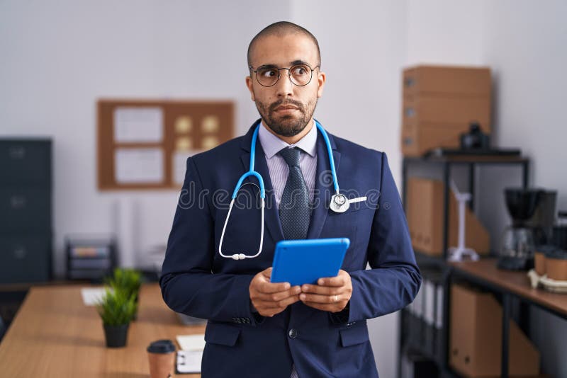 Hispanic Man with Beard Wearing Doctor Stethoscope Working at the ...