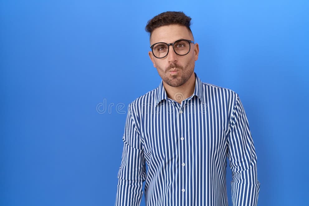 Hispanic Man with Beard Wearing Glasses Making Fish Face with Lips ...