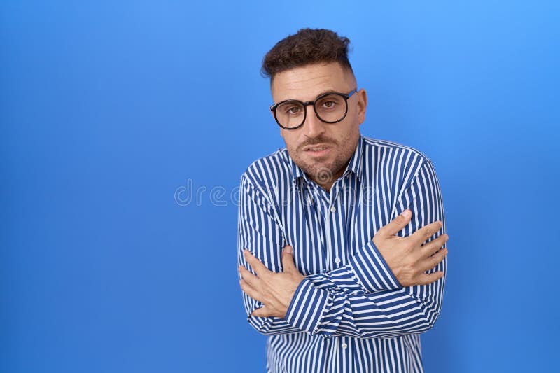 Hispanic Man with Beard Wearing Glasses Shaking and Freezing for Winter ...