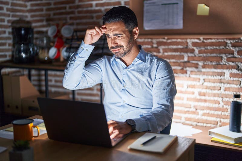 Hispanic Man with Beard Working at the Office at Night Worried and ...