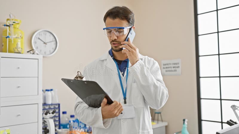 Handsome Hispanic Man Smiling while Relaxing Alone in a Well-lit Modern ...
