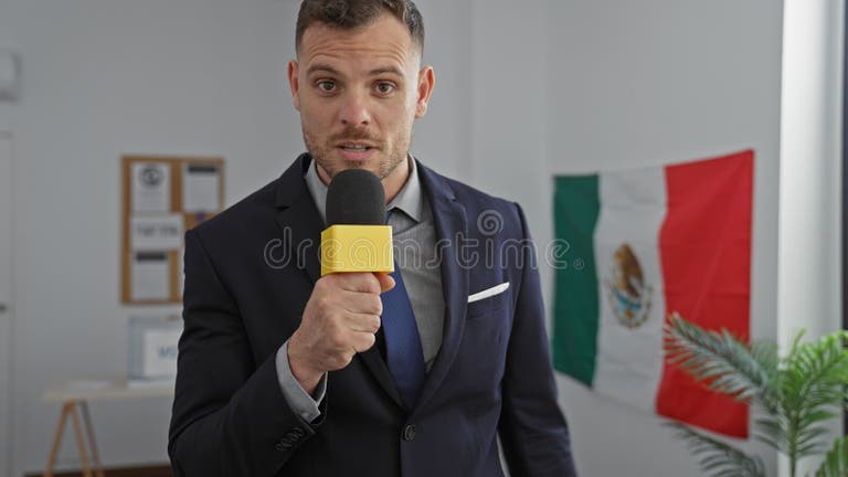 Hispanic Man in Suit Reports with Microphone Against Mexico Flag ...