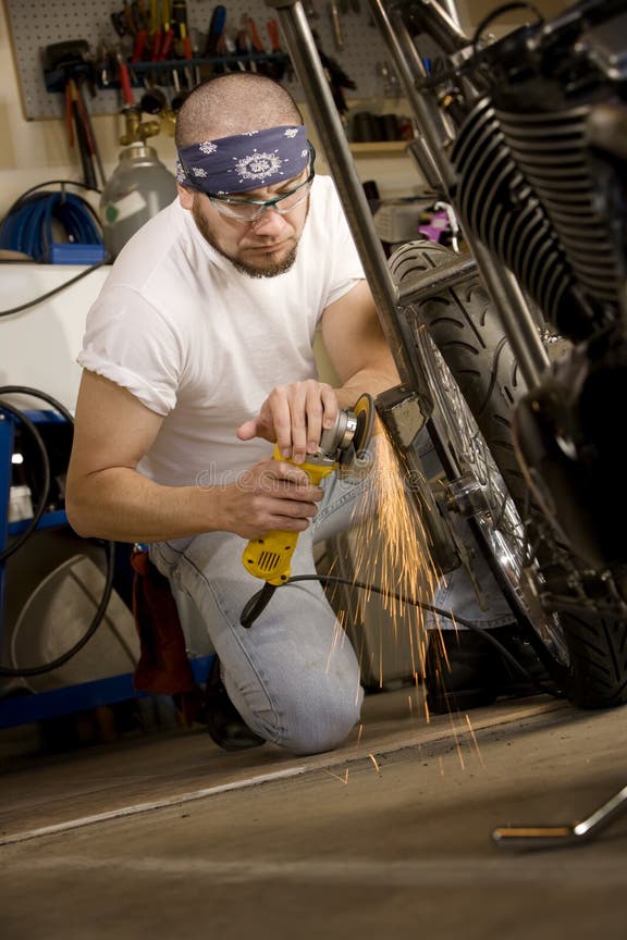 Hispanic Man Using Grinder on Motorcycle Stock Photo - Image of tire ...