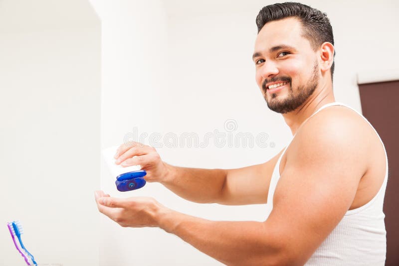 Handsome Guy Putting on Some Deodorant Stock Photo - Image of morning ...