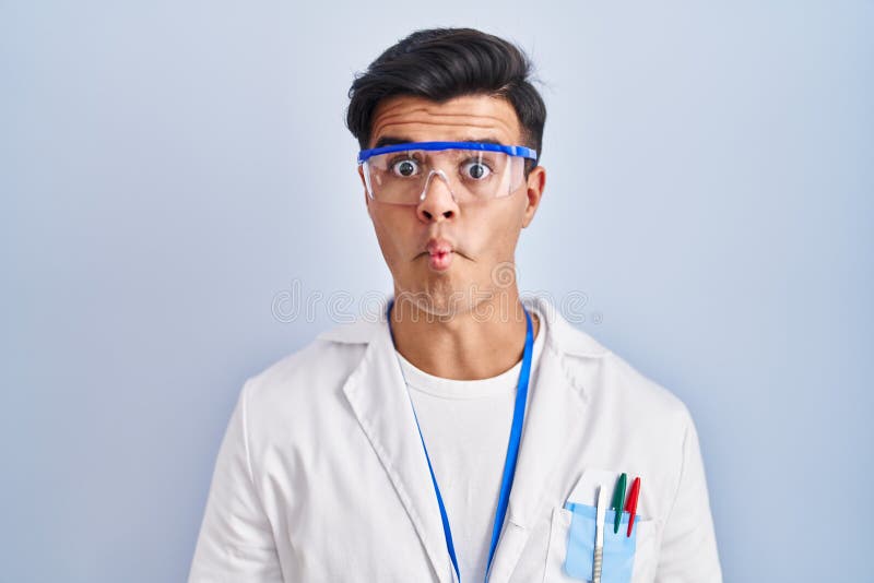 Hispanic Man Working As Scientist Making Fish Face with Lips, Crazy and ...