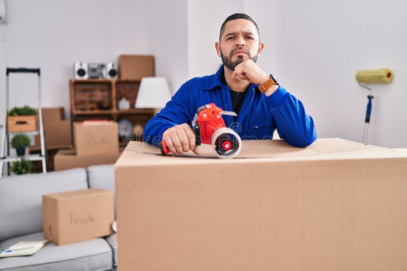 Hispanic Man Working on Moving Holding Packing Tape Serious Face ...