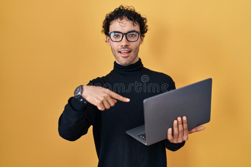 Hispanic Man Working Using Computer Laptop Smiling Happy Pointing with ...