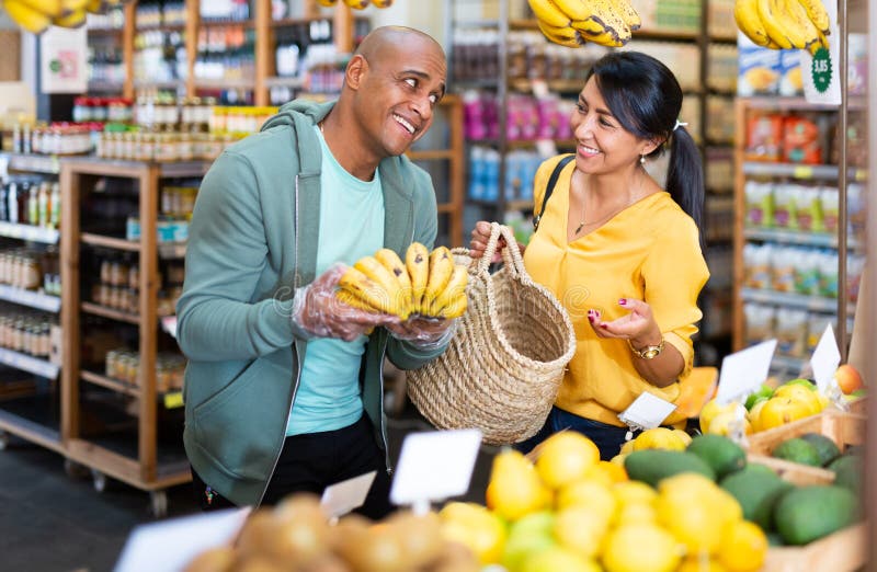 Hispanic Married Couple Choosing Bananas in Grocery Store Stock Photo ... Hispanic Married Couple Choosing Bananas in Grocery Store Stock Photo ...