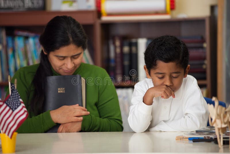 Hispanic Mom and Boy Praying during Worship Stock Photo - Image of ...