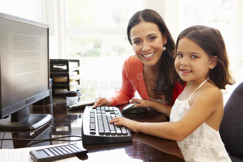 Hispanic Mother and Daughter Using Computer at Home Stock Image - Image ...