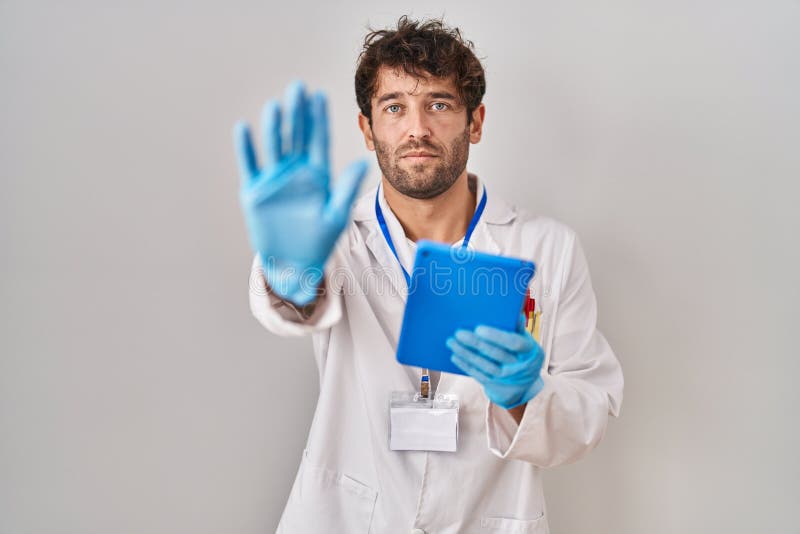 Hispanic Scientist Man Working with Tablet with Open Hand Doing Stop ...