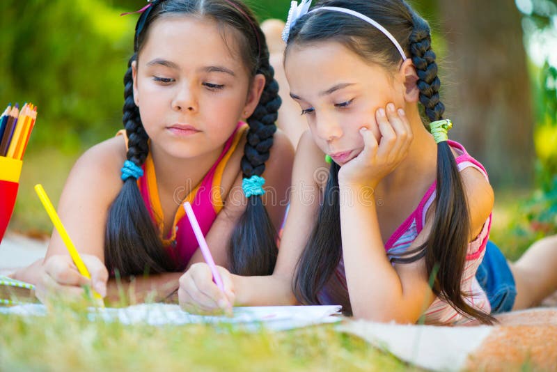 Hispanic Sisters Sitting Under the Tree and Talking Stock Photo - Image ...