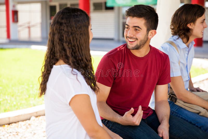 Hispanic Students Talking at School Stock Photo - Image of friendship ...