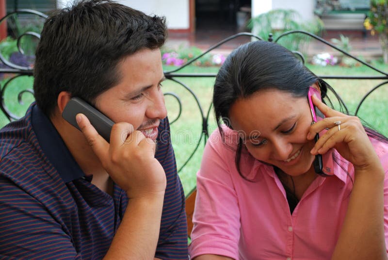 Hispanic Students Talking on Their Cellphones Stock Photo - Image of ...