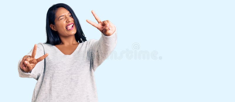 Hispanic Woman With Long Hair Wearing Casual Clothes Smiling With