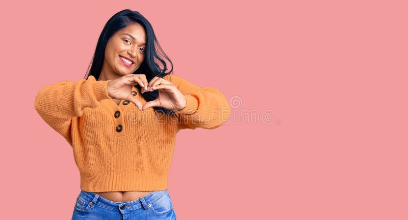Hispanic Woman With Long Hair Wearing Casual Winter Sweater Smiling In