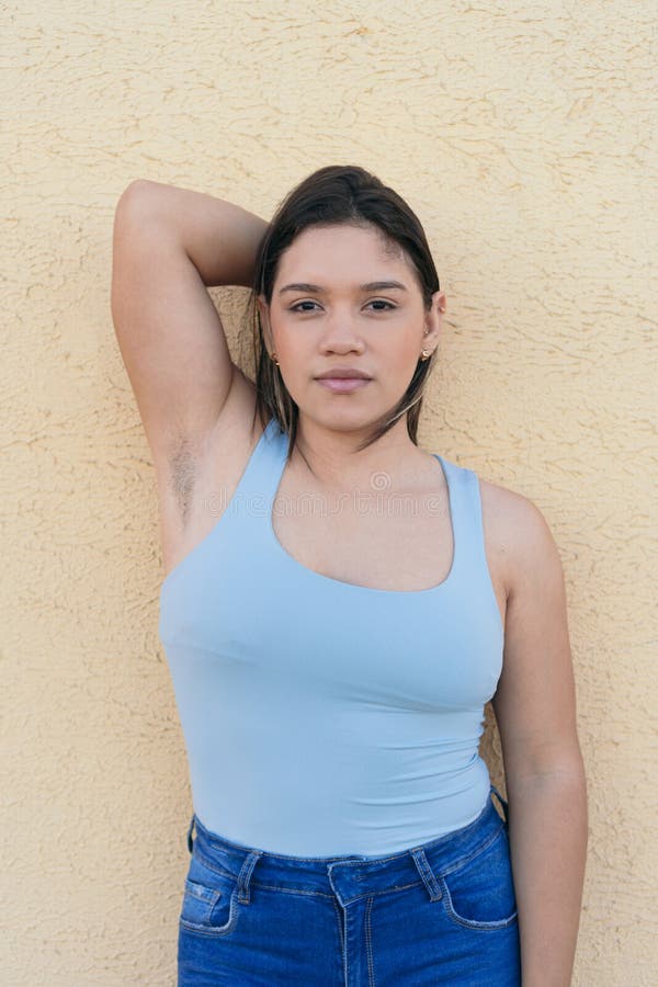 Hispanic Woman with Unshaven Armpits Confidently Looking at the Camera ...