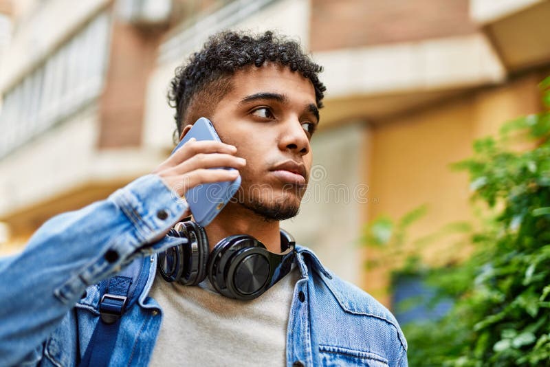 Hispanic Young Man Speaking on the Phone at the Street Stock Image ...