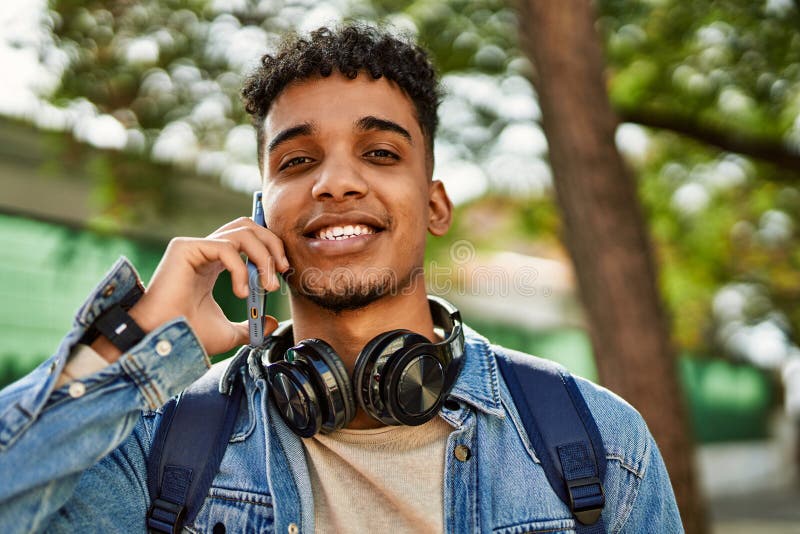 Hispanic Young Man Speaking on the Phone at the University Campus Stock ...