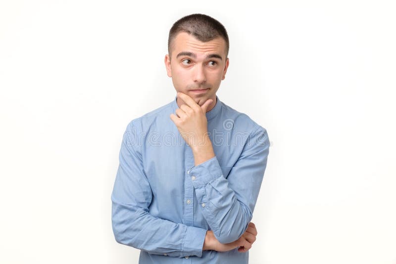 Hispanic Young Man Thinking about Idea or Making a Choice. Stock Photo ...