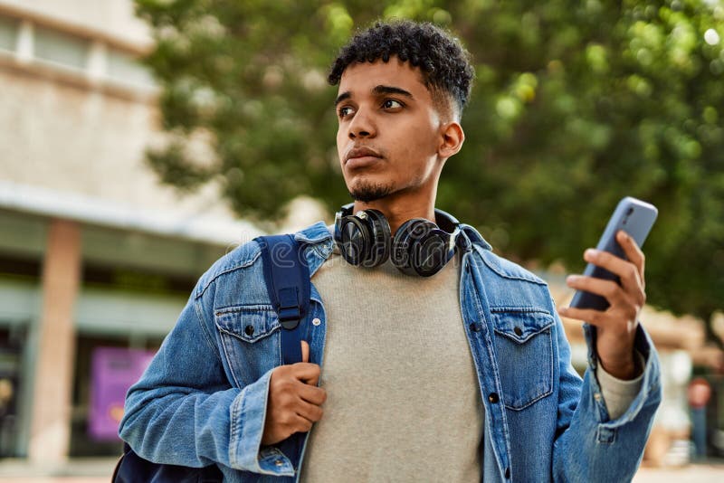 Hispanic Young Man Using Smartphone at the Street Stock Image - Image ... Hispanic Young Man Using Smartphone at the Street Stock Image - Image ...