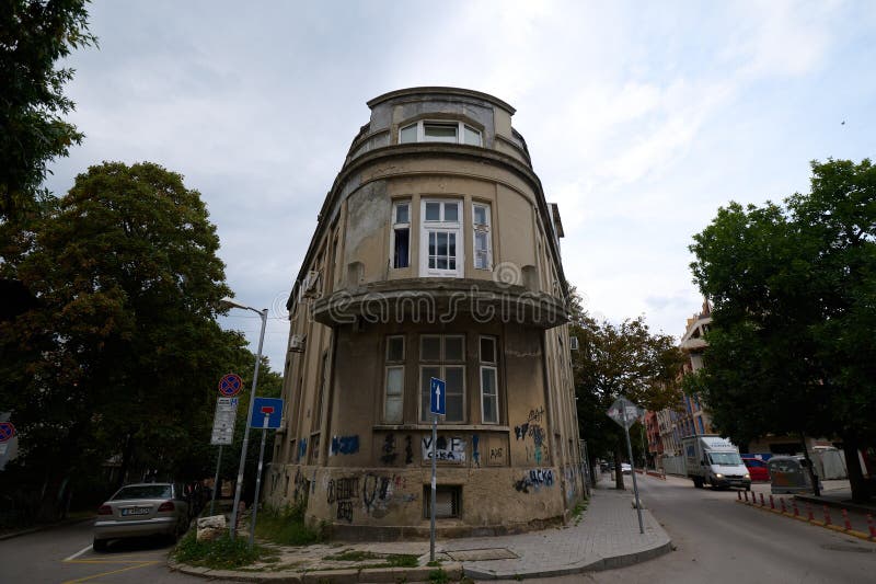 Historic Architecture Featuring a Unique Corner Building with Graffiti ...