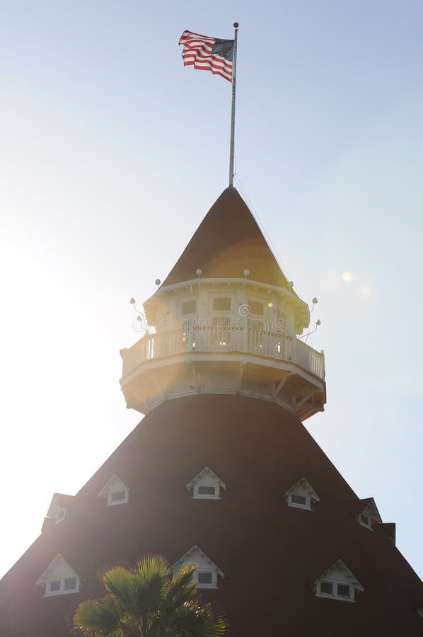 Historic Beachfront Hotel Tower with American Flag on Sunny Day Stock ...