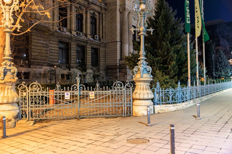 Historic Building Facade and Decorative Iron Gate at Night. March 8 ...