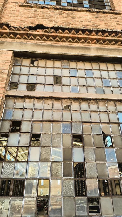 A Historic Building Made of Clay Bricks and Large Windows Stock Photo ...