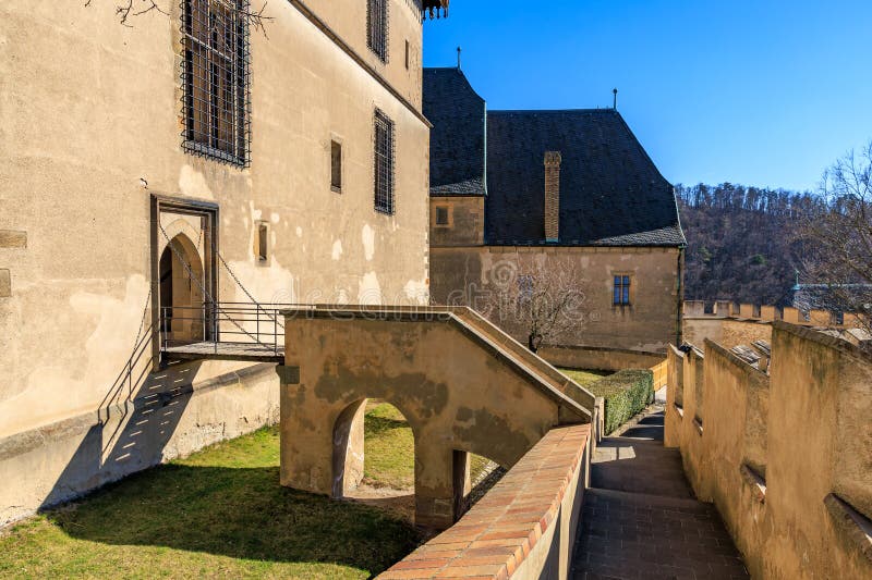 Historic Castle Courtyard with Stone Walls and Pathway on a Clear Day ...