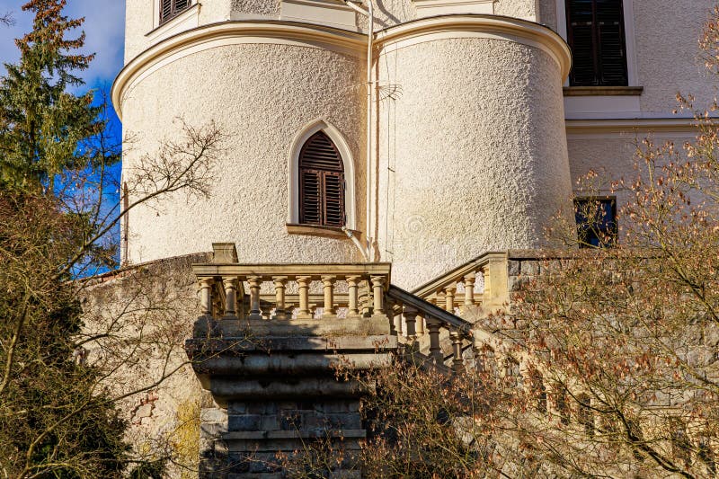 Historic Castle Tower with Stone Staircase and Arched Window Surrounded ...
