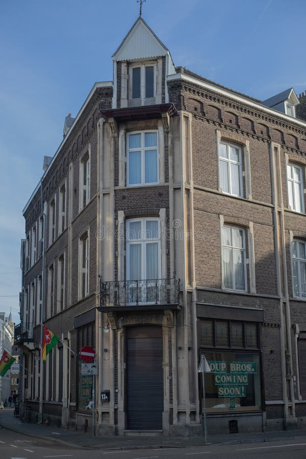 Historic Corner Building with Elegant Architecture and Flags in the ...