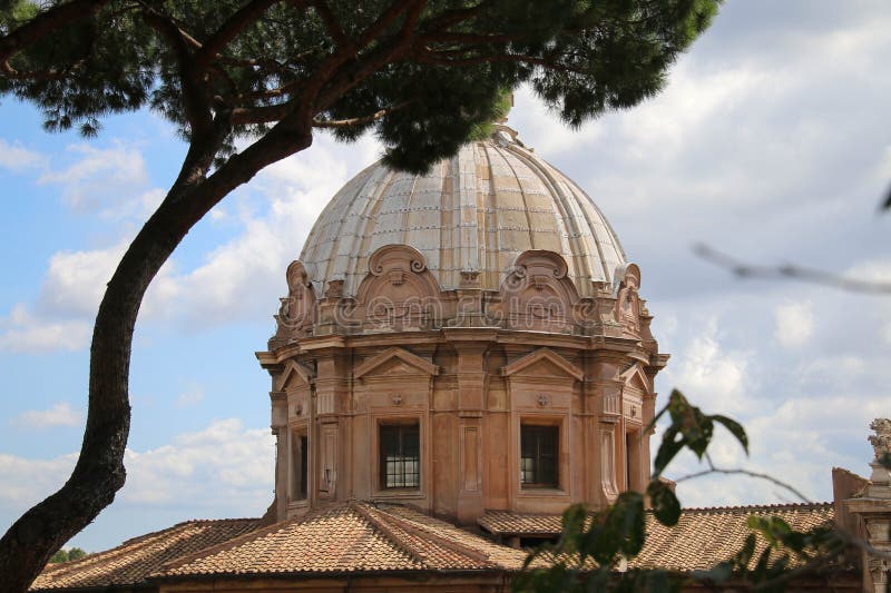 Historic Dome Architecture Framed by Trees, Set Against Clear Blue Sky ...