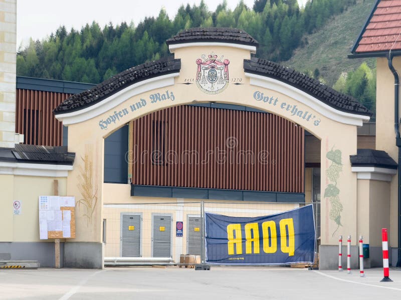 Historic German Brewery Entrance with Emblem and Decorative Arch ...
