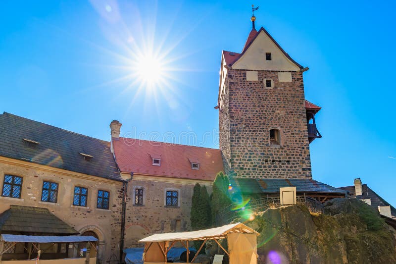 Historic Medieval Castle Under Bright Blue Sky with Sunburst Effect ...