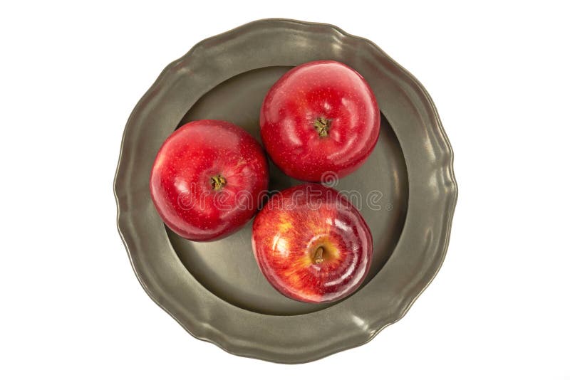 A Historic, Metal Plate with Three Red Apples on a White Background ...