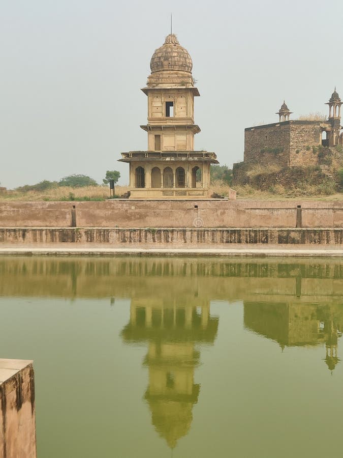 Historical Pavilion Reflecting on the Serene Water, Surrounded by ...