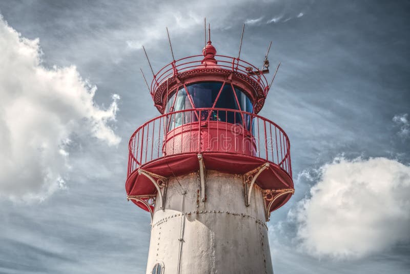 Historic Red Lighthouse on Background of Blue Dramatic Sky. Stock Image ...