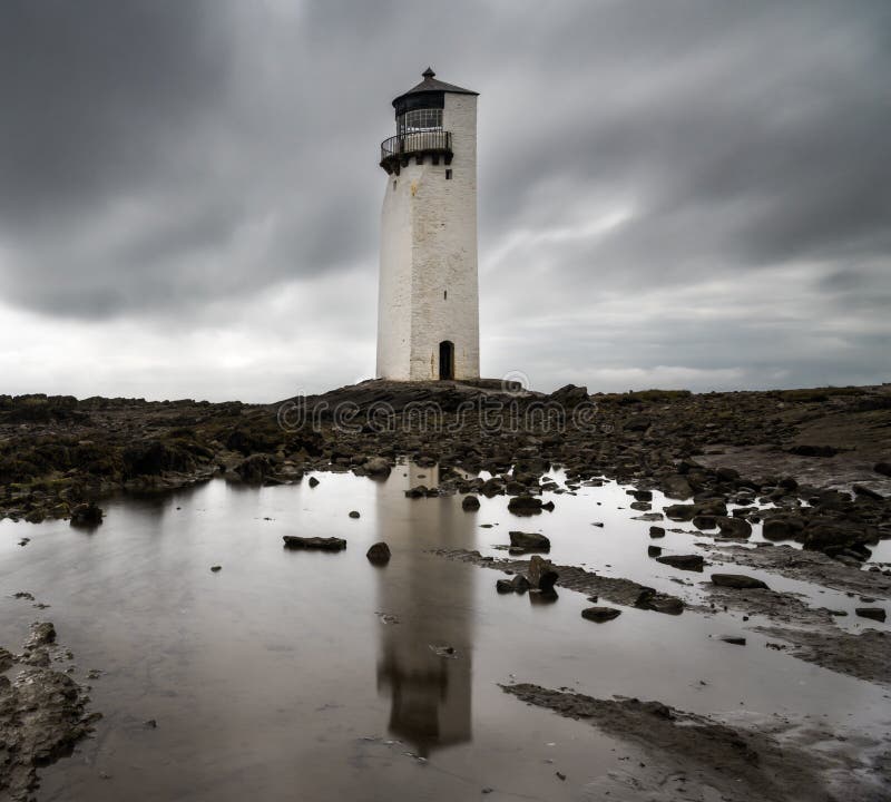 The Historic Southerness Lighthouse in Scotland with Reflections in ...