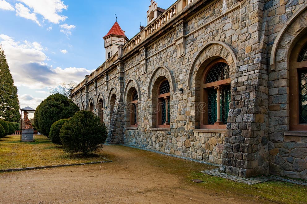 Historic Stone Building Exterior with Tower and Arched Windows Stock ...