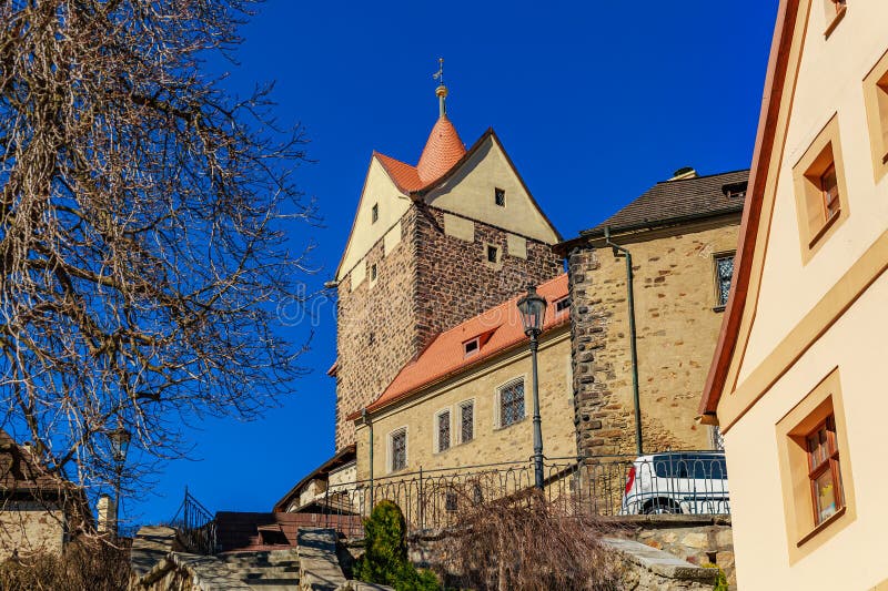 Historic Stone Castle with Red Roof and Blue Sky in Tranquil Setting ...