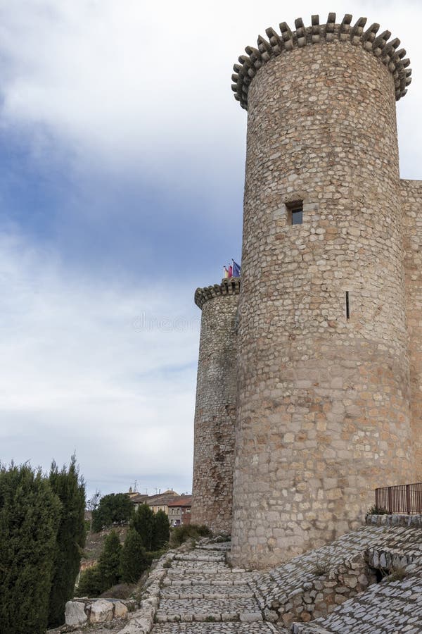A Historic Stone Castle with a Round Tower, Under a Cloudy Sky, with ...