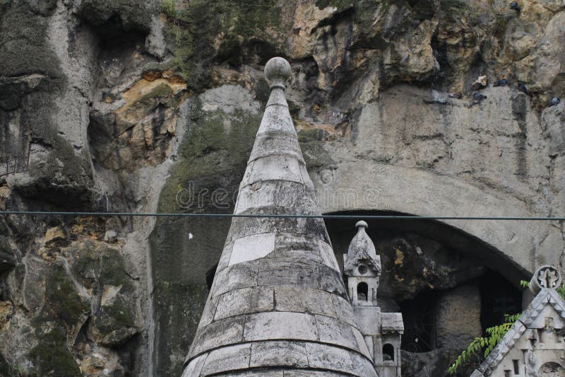Historic Stone Structures and Spires Emerge from Rugged Cliffs at a ...