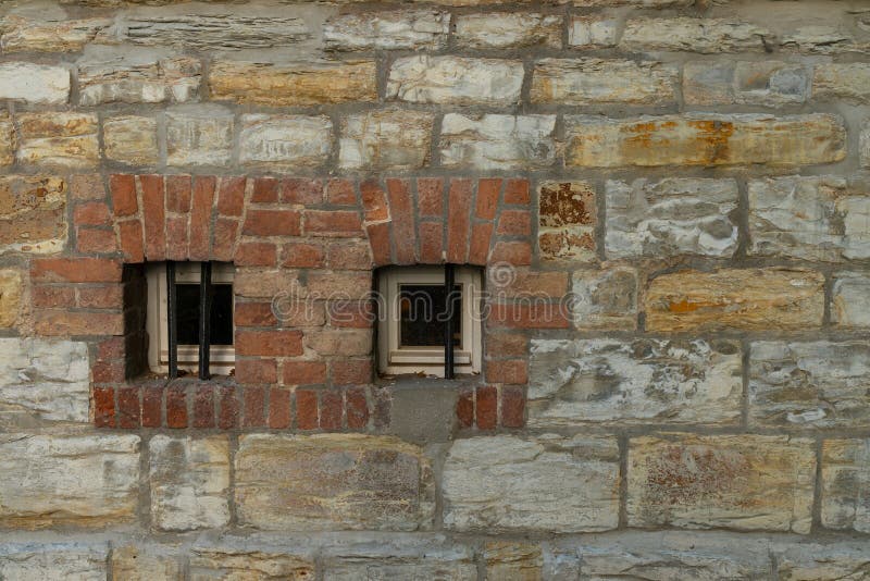 Historic Stone Wall with Two Barred Windows in an Old Building Stock ...