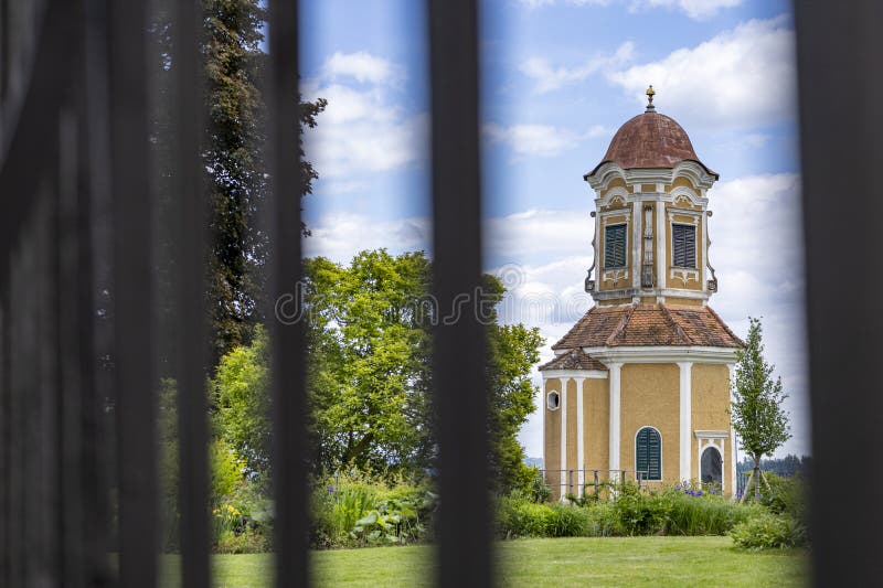 Historic Tower Behind Iron Bars Stock Image - Image of serene, heritage ...
