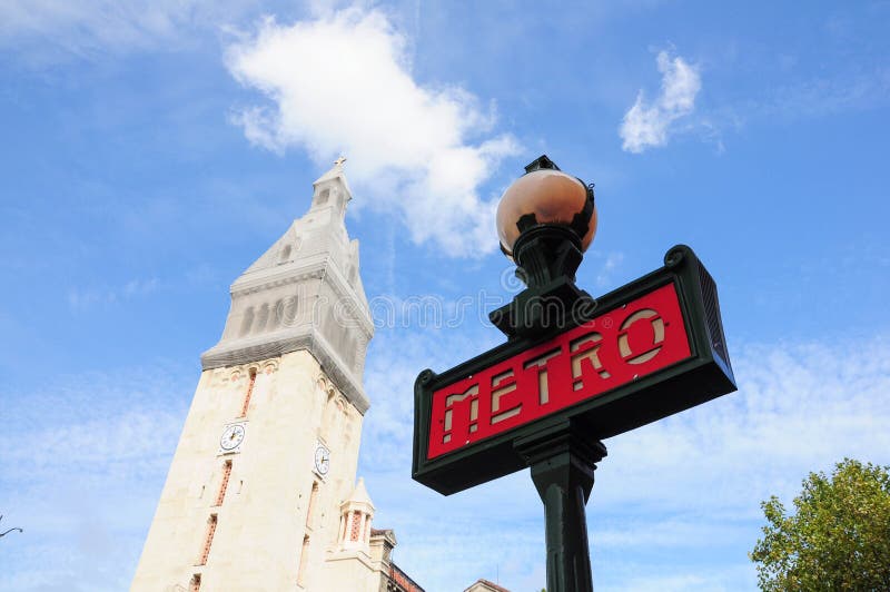 Historic Tower and Red Metro Sign Under Clear Blue Sky in Paris Stock ...