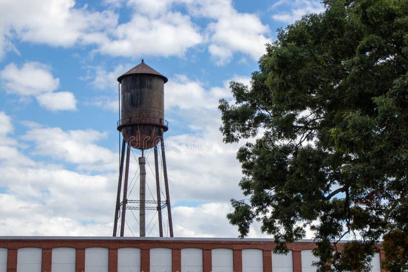 Old water tower in the sky stock image. Image of historic - 262377459