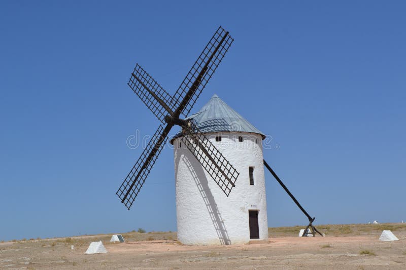 Historic Windmill in La Mancha, Spain Under Clear Blue Skies. Campo De ...
